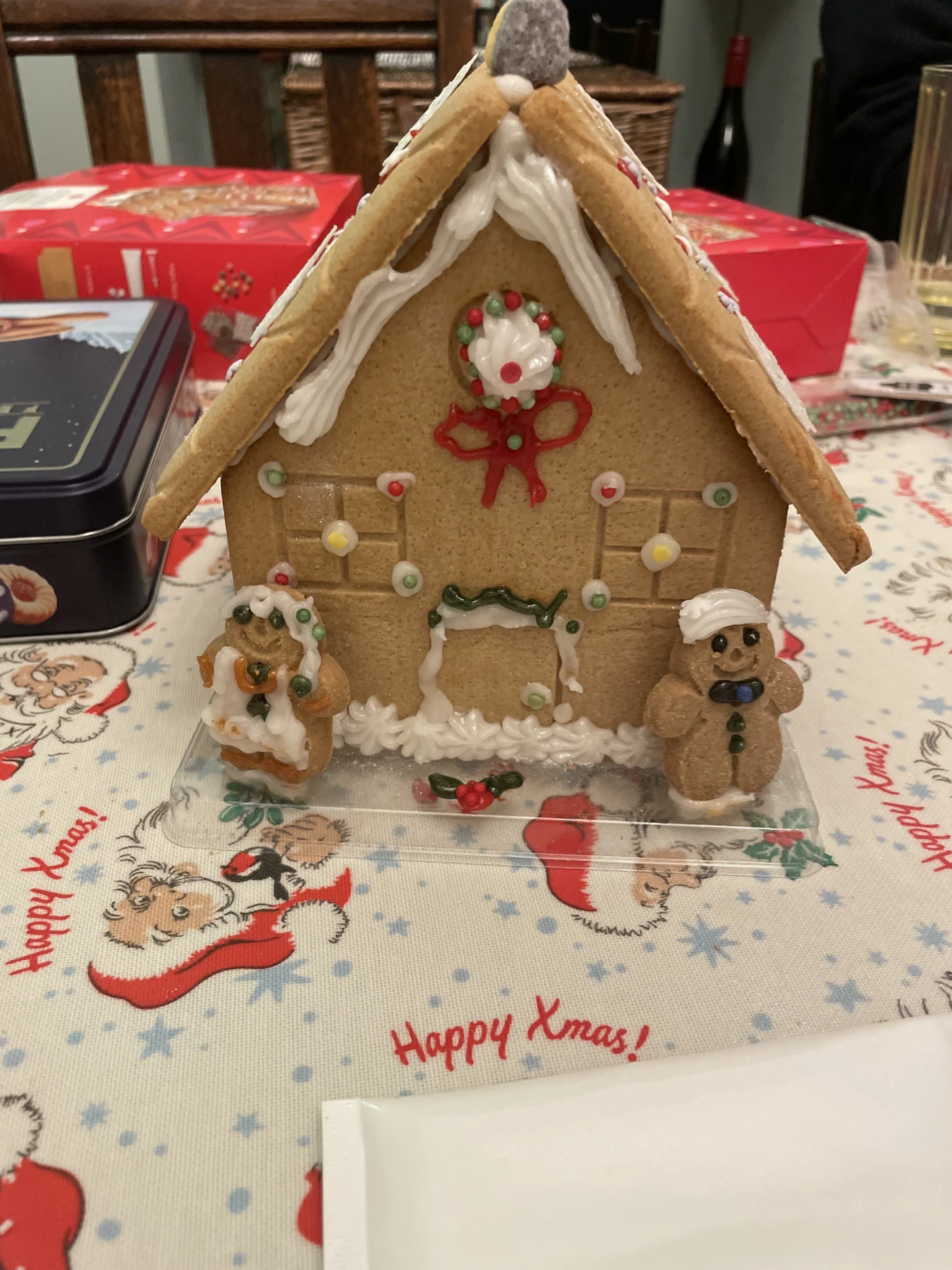 Made a gingerbread house the gingerbread man on the left is supposed to ...